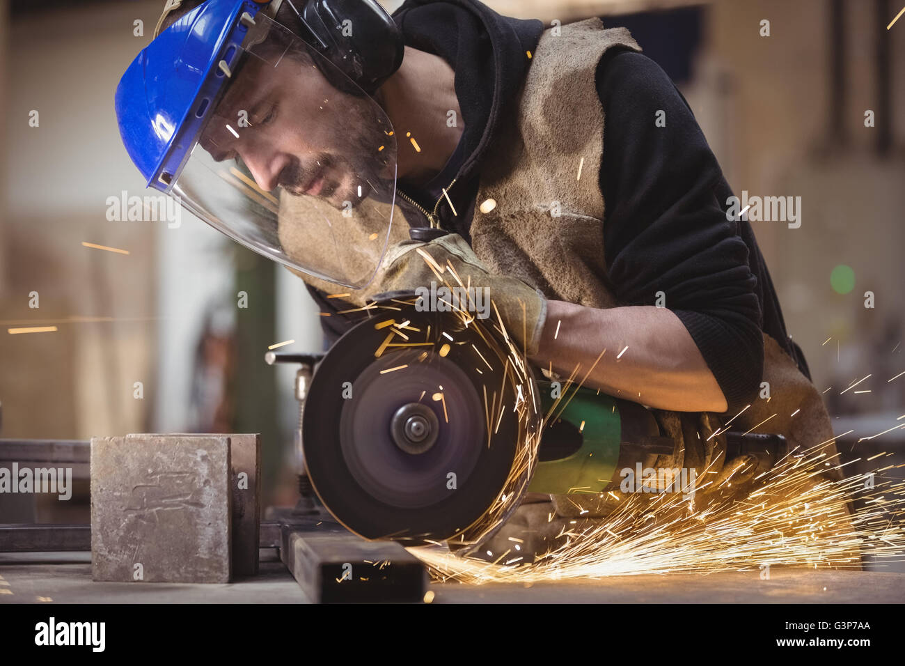 Welder working with machine Stock Photo - Alamy