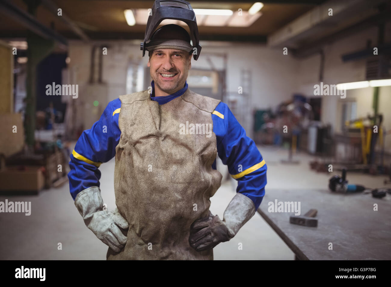 Worker smiling at camera Stock Photo - Alamy