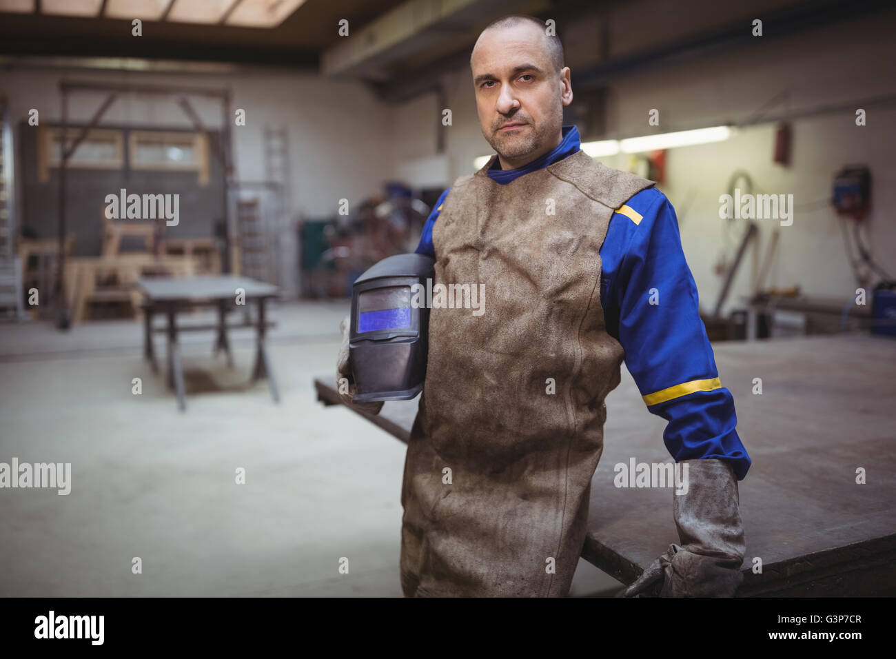 Welder looking at the camera Stock Photo - Alamy