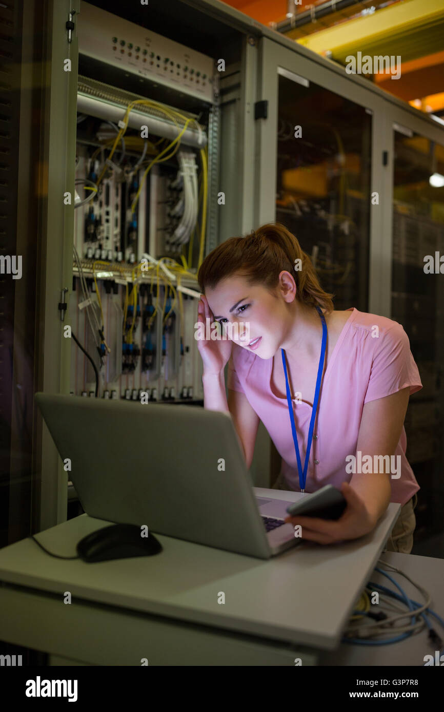 Stressed technician working on laptop Stock Photo - Alamy