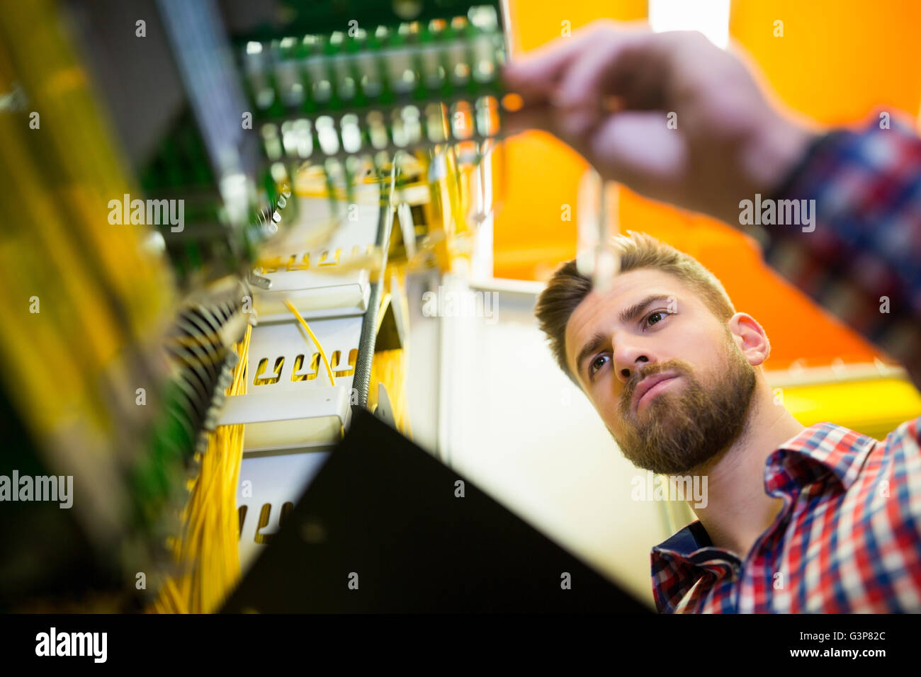 Technician working on broken server Stock Photo - Alamy