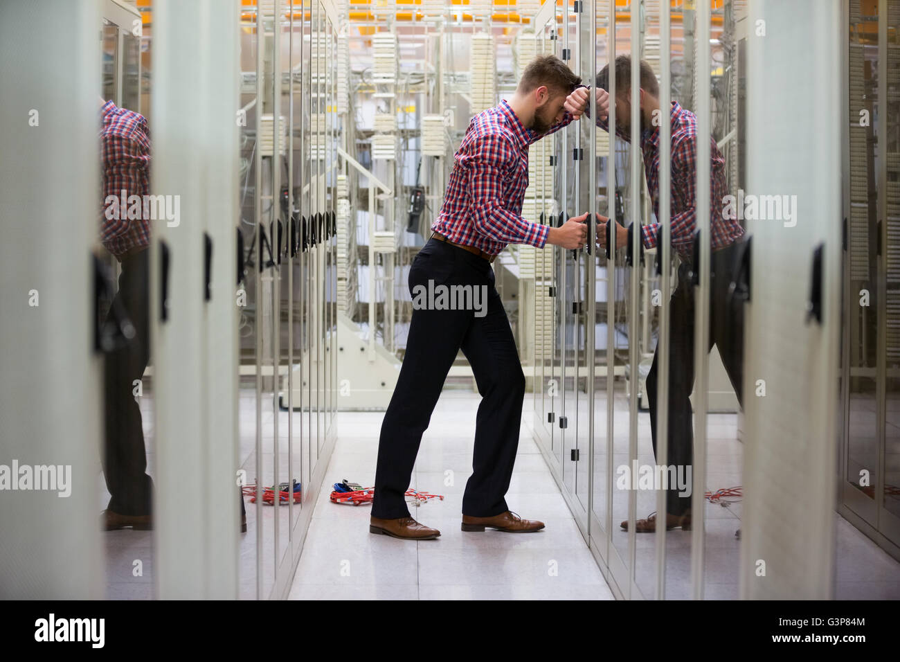 Technician getting stressed over server maintenance Stock Photo - Alamy
