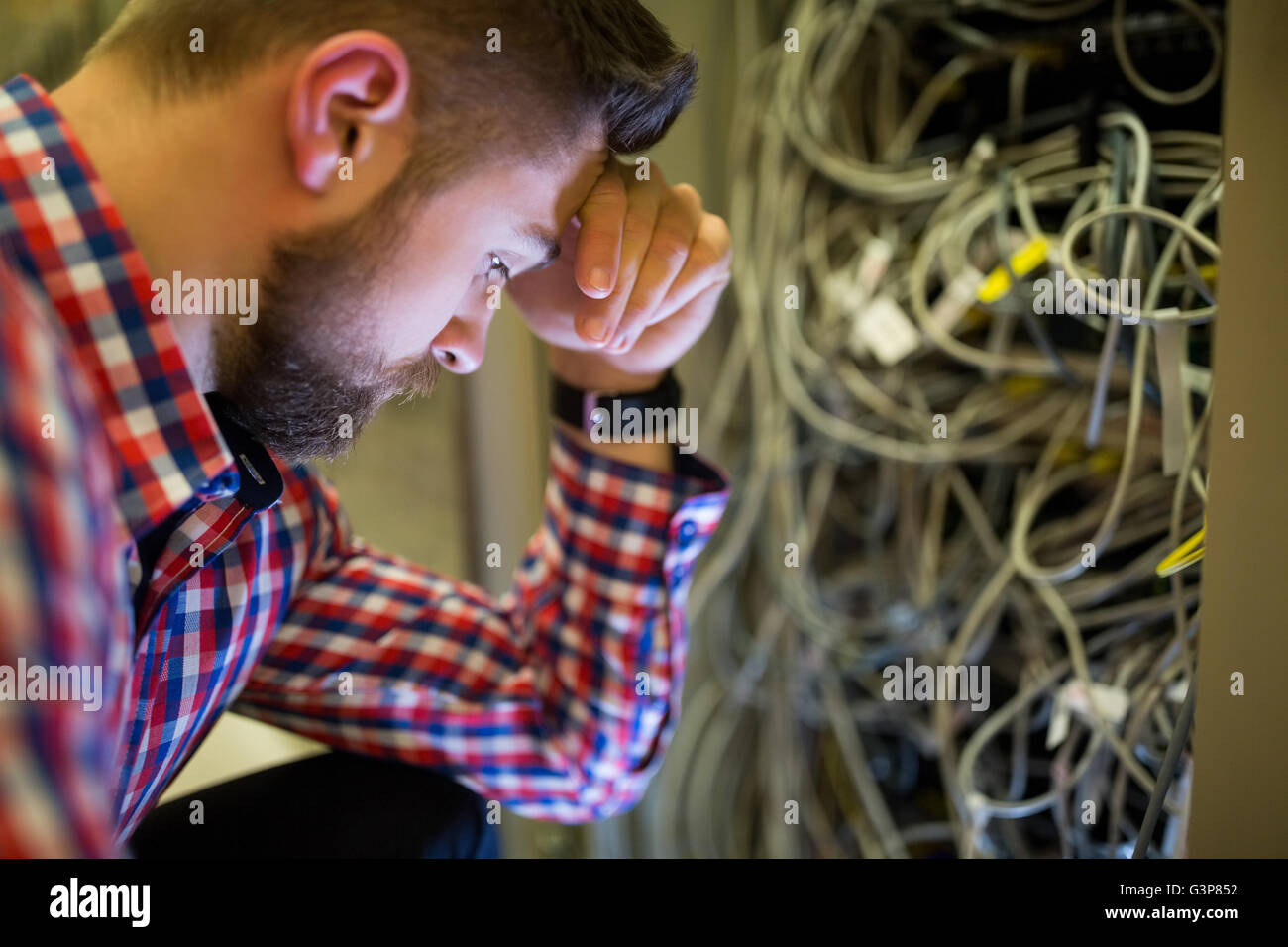 Technician getting stressed over server maintenance Stock Photo - Alamy