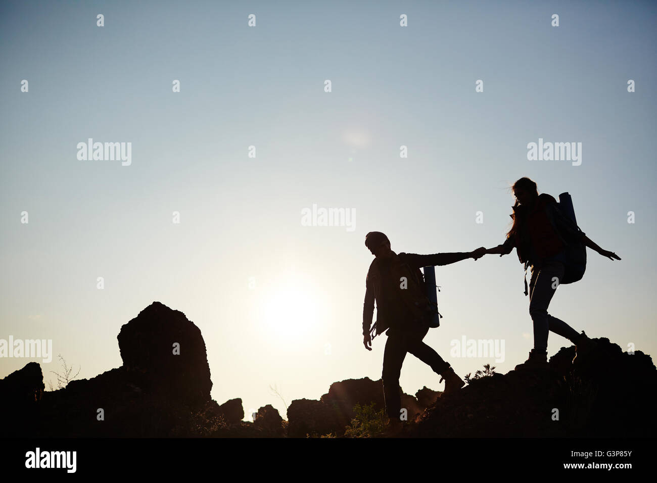 Adult couple descending the mountain hi-res stock photography and ...