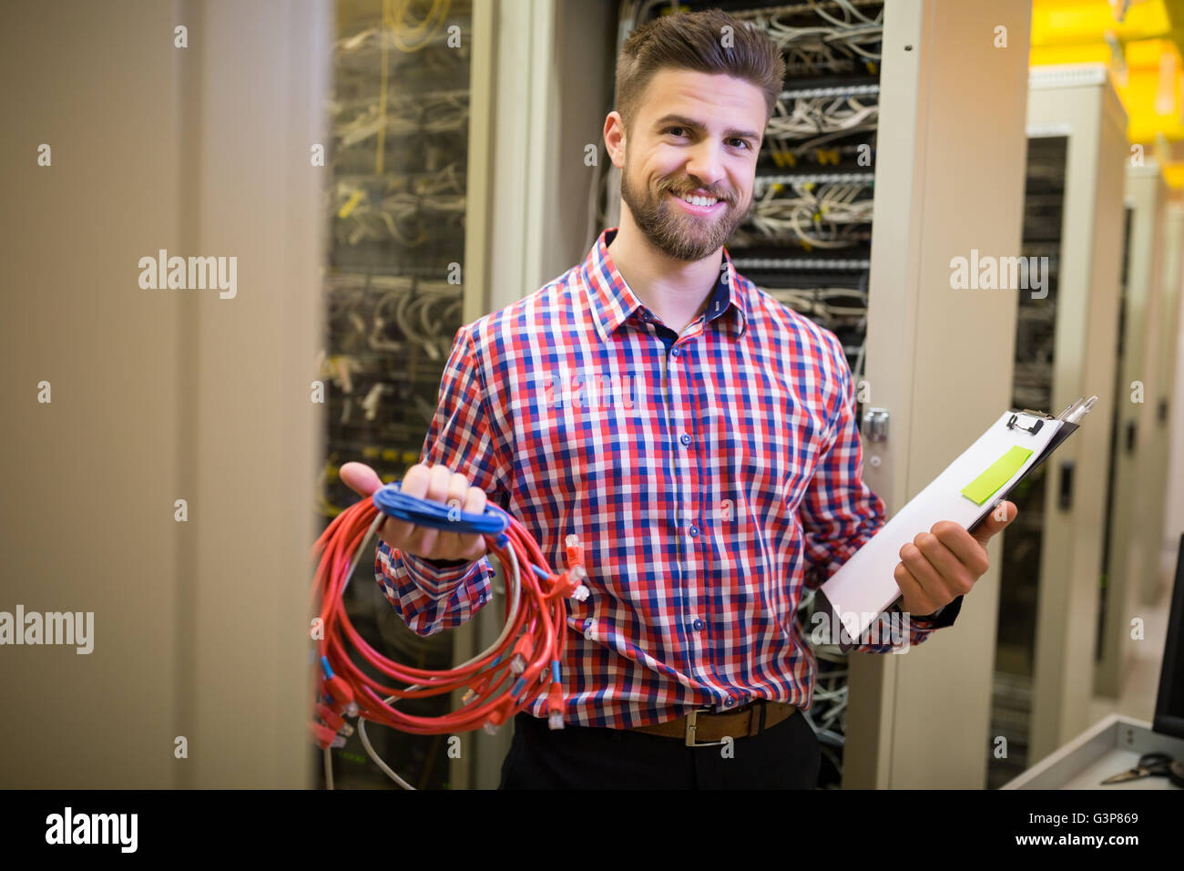 Holding computer and cable hi-res stock photography and images - Alamy