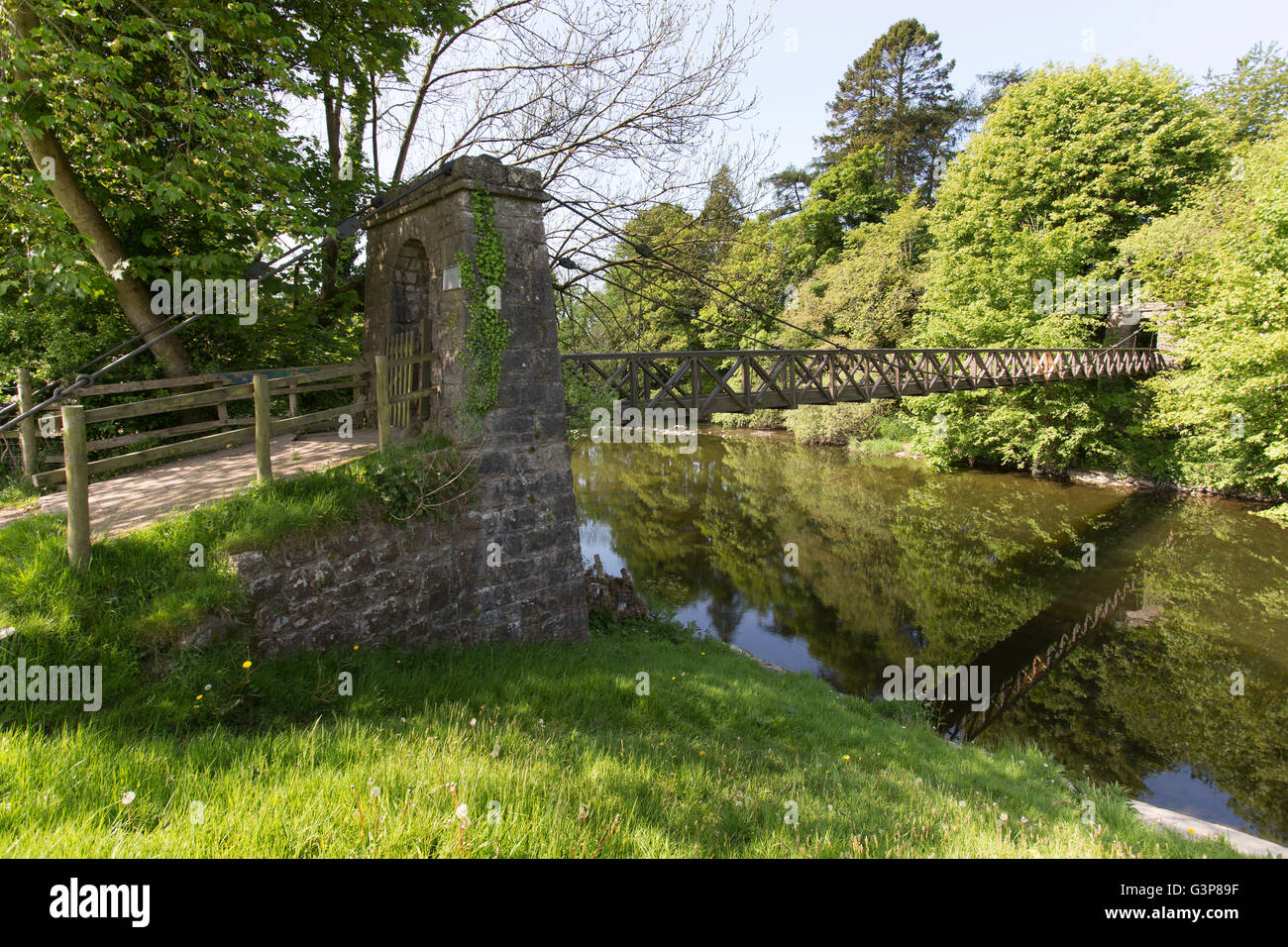 River Kent, England. Picturesque view of a footbridge over the River ...