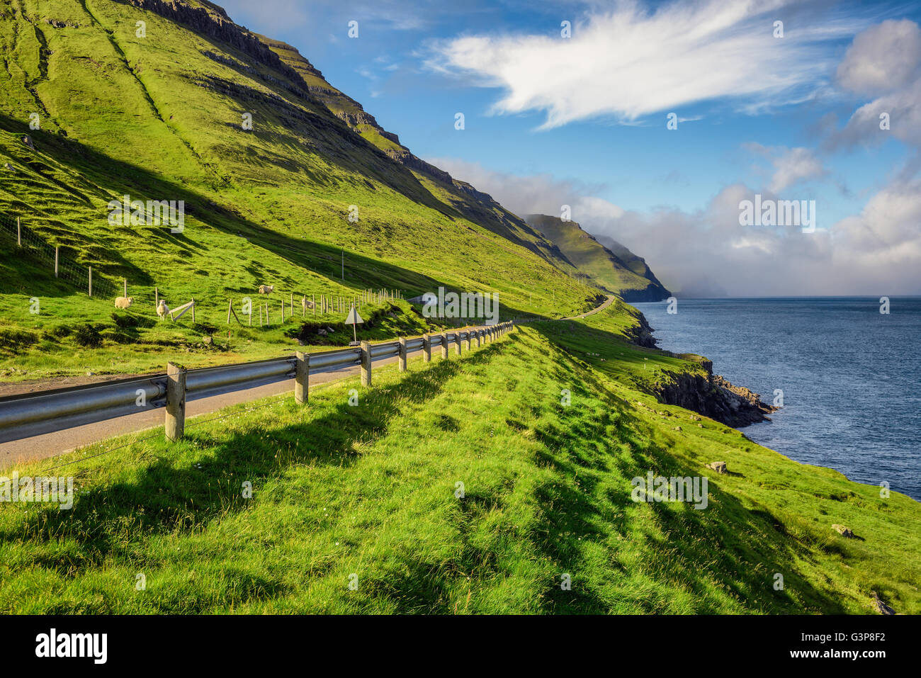 Coastal road through the island of Kalsoy, Faroe archipelago in Denmark ...