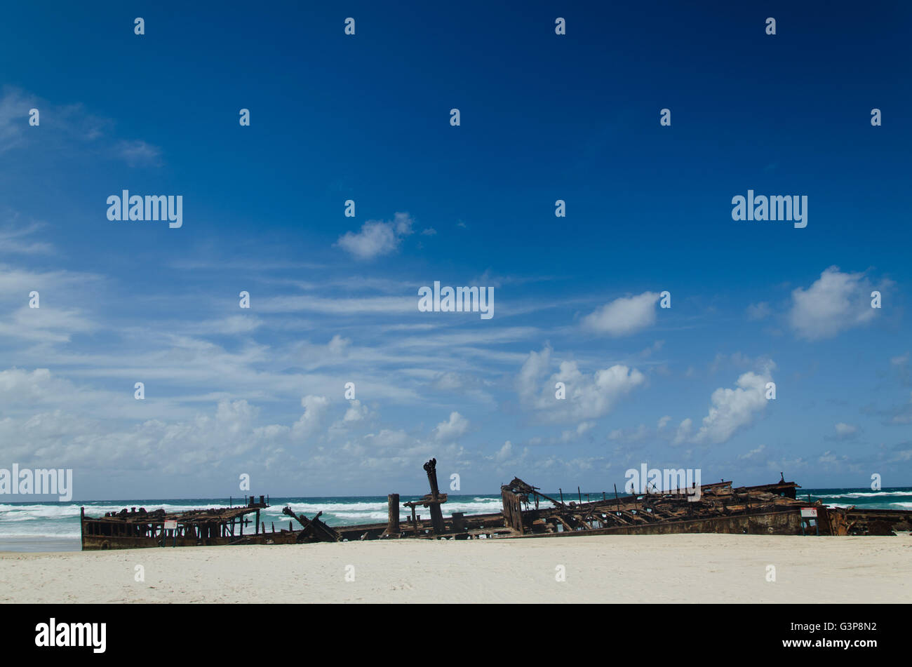 Impressive SS Maheno luxury shipwreck resting on the beach on clear ...