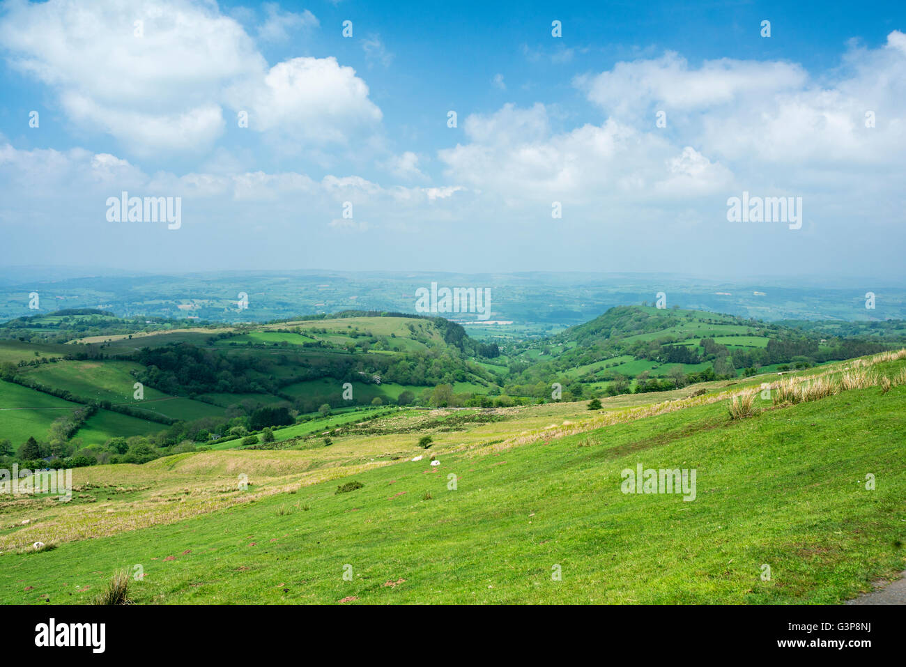 Looking down a valley towards farmland and the hills beyond Stock Photo ...