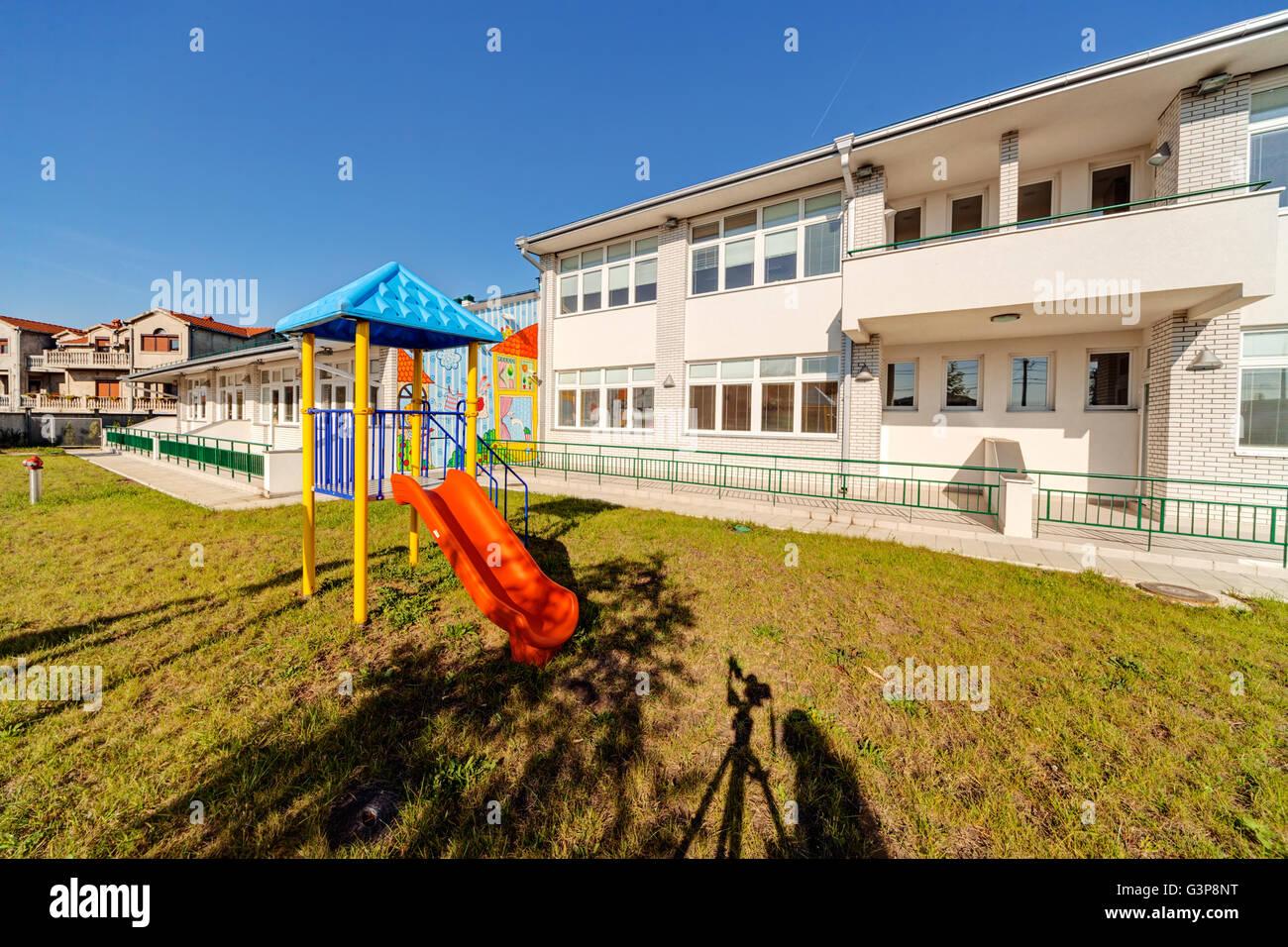 Preschool building exterior with playground on a sunny day Stock Photo ...