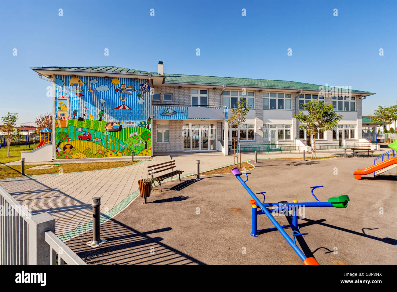 Preschool building exterior with playground on a sunny day Stock Photo ...