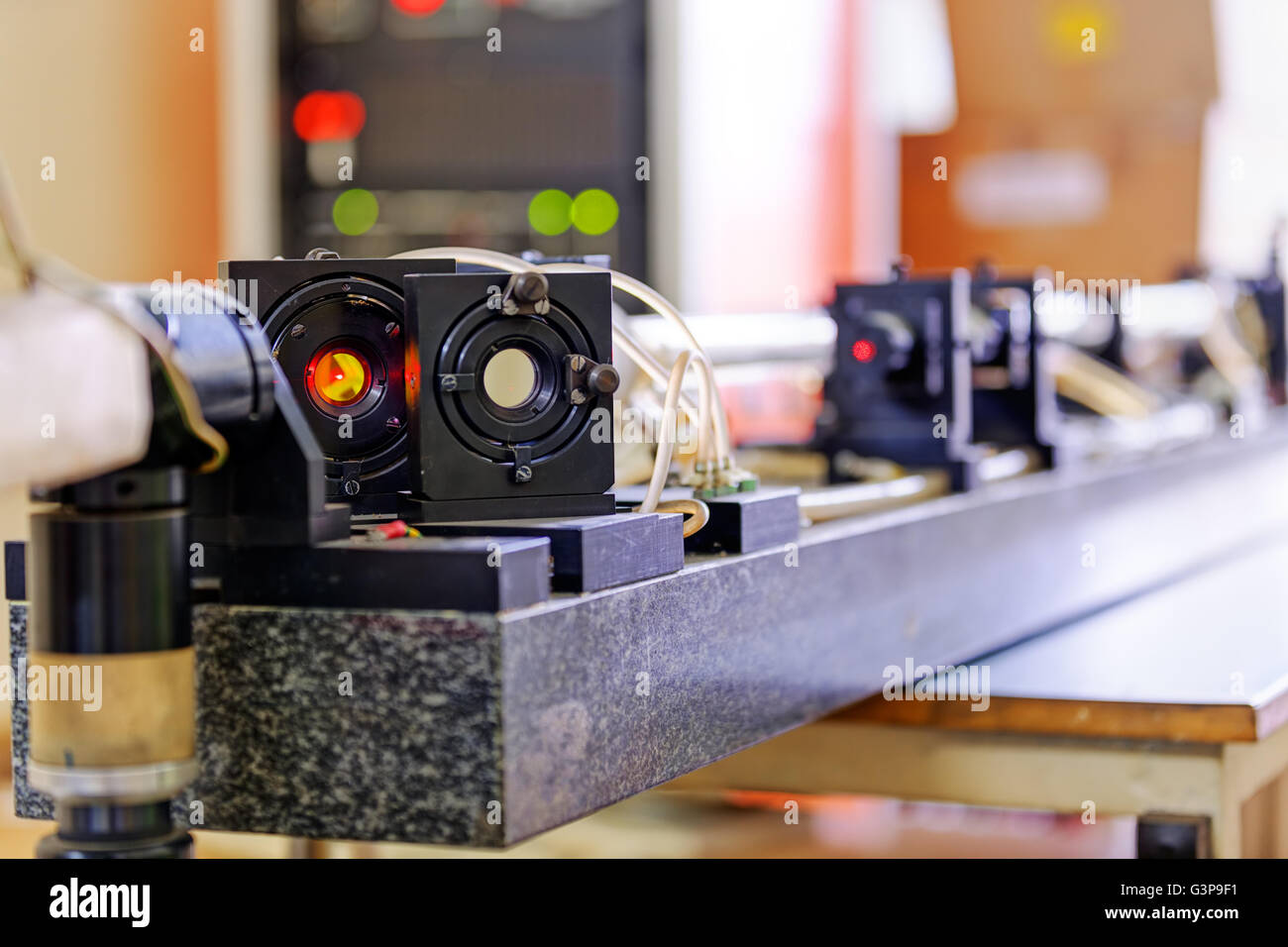 Red laser on optical table in physics laboratory Stock Photo - Alamy