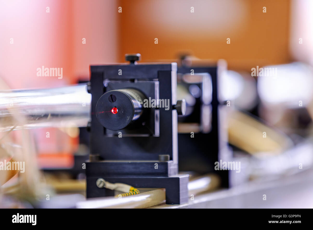 Red laser on optical table in physics laboratory Stock Photo - Alamy