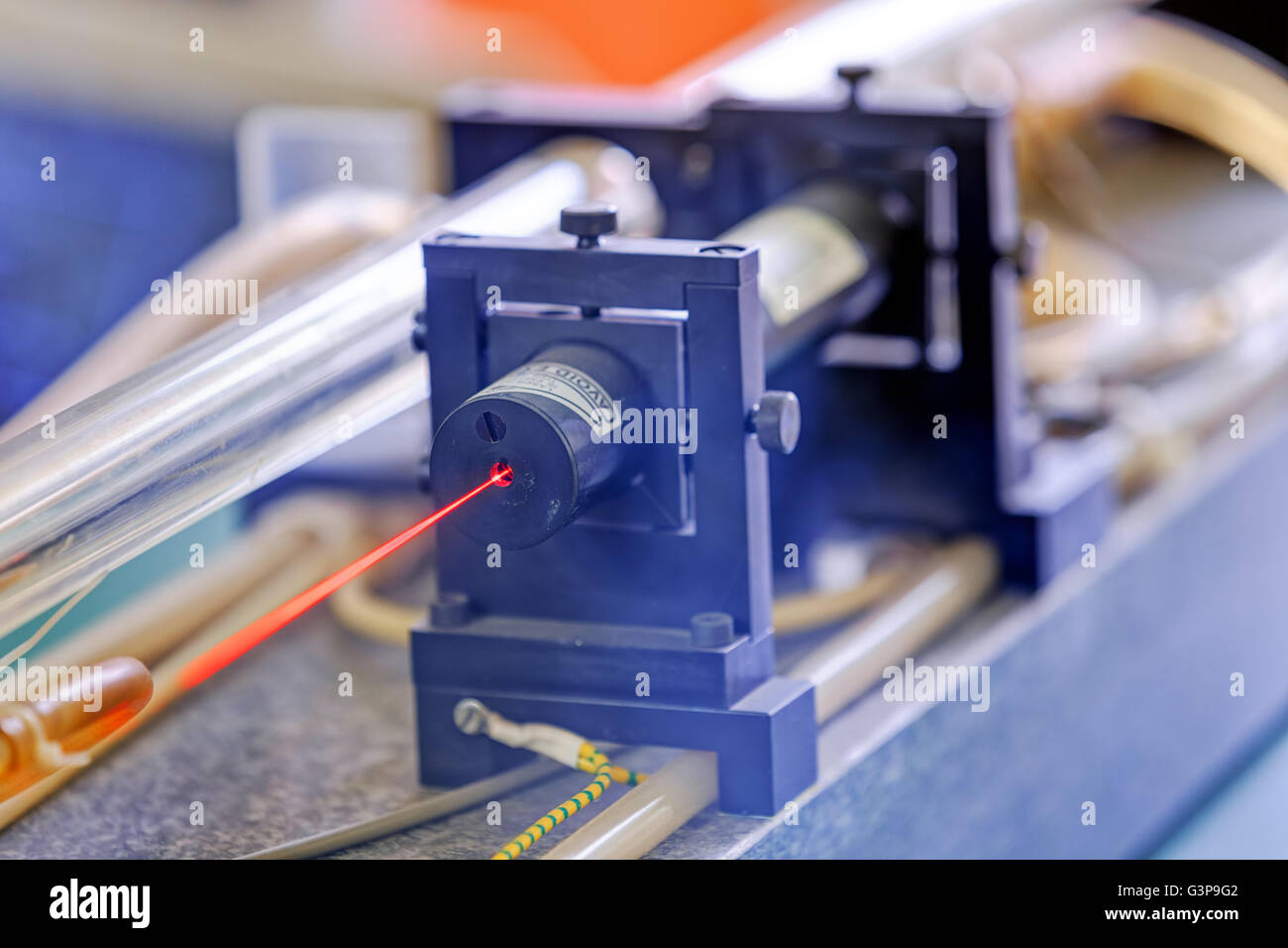 Red laser on optical table in physics laboratory Stock Photo - Alamy