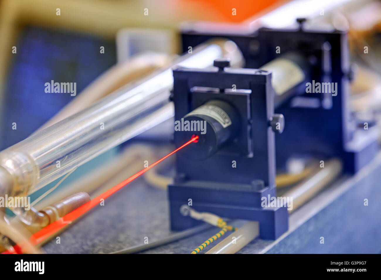 Red laser on optical table in physics laboratory Stock Photo - Alamy