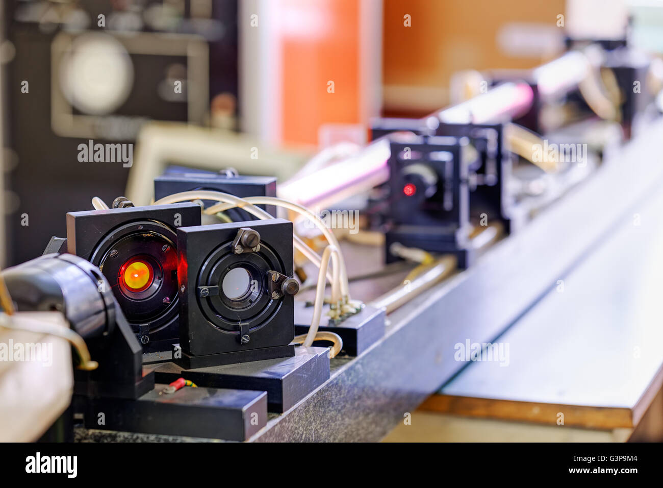 Red laser on optical table in physics laboratory Stock Photo - Alamy