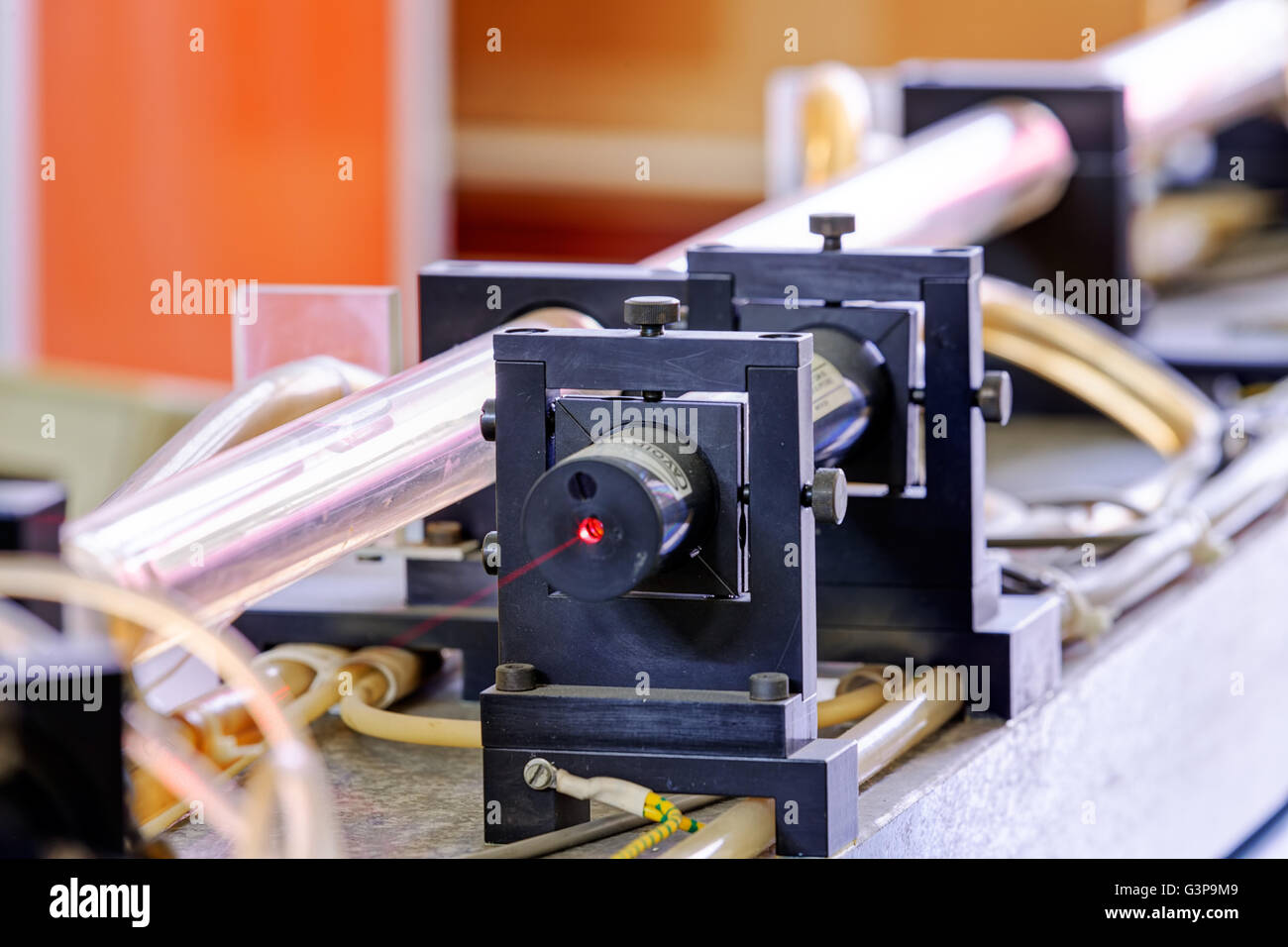 Red laser on optical table in physics laboratory Stock Photo - Alamy