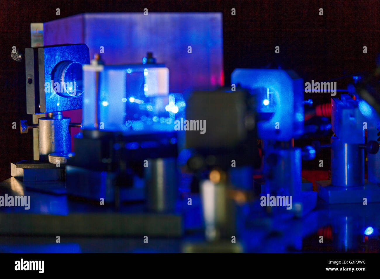 Blue laser on optical table in a quantum optics lab Stock Photo - Alamy