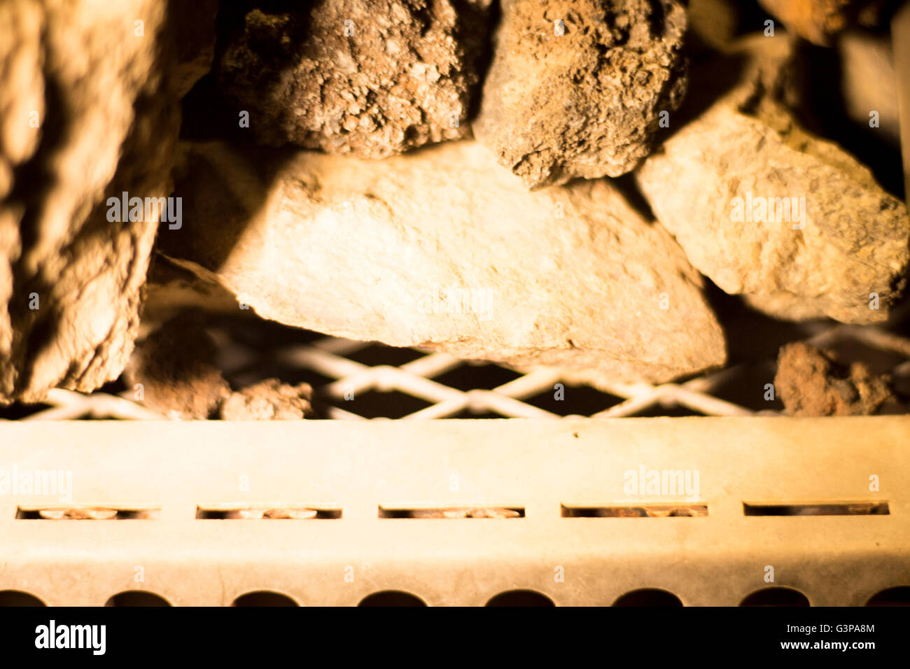 Wood sauna heated rocks heater photo Stock Photo - Alamy