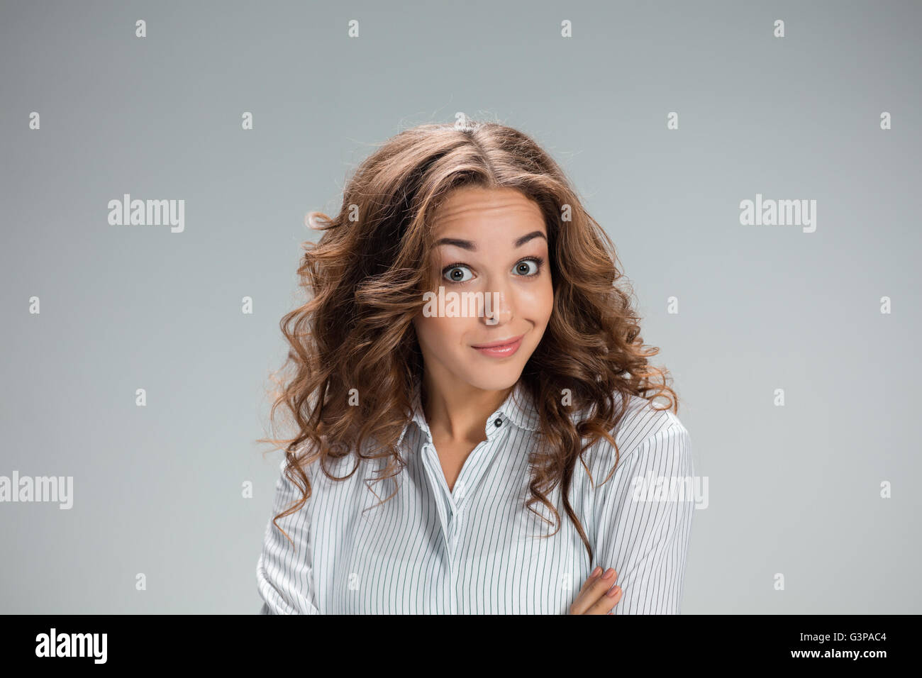 Portrait of young woman with shocked facial expression Stock Photo - Alamy