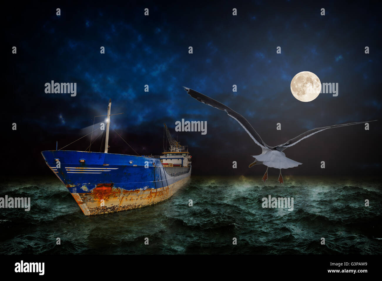 Cargo ship in time of storm at night Stock Photo - Alamy