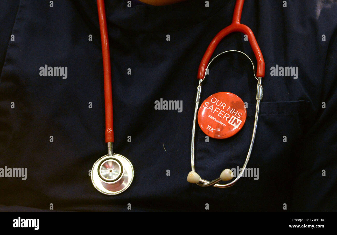 An NHS staff member wears a badge of support as Labour Party leader ...