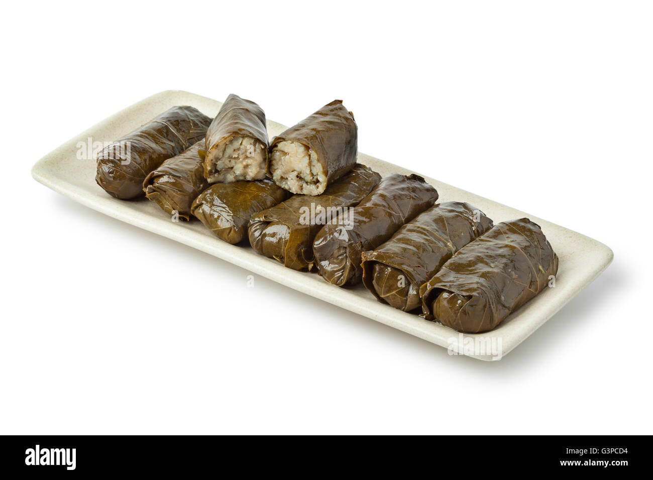 Traditional greek dolmades on a dish on white background Stock Photo ...