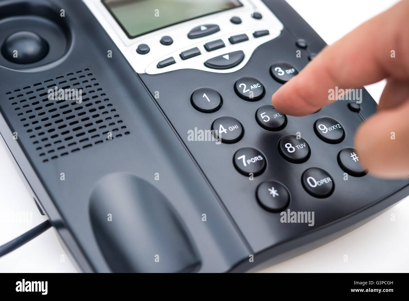 man dialing a black telephone close up Stock Photo - Alamy