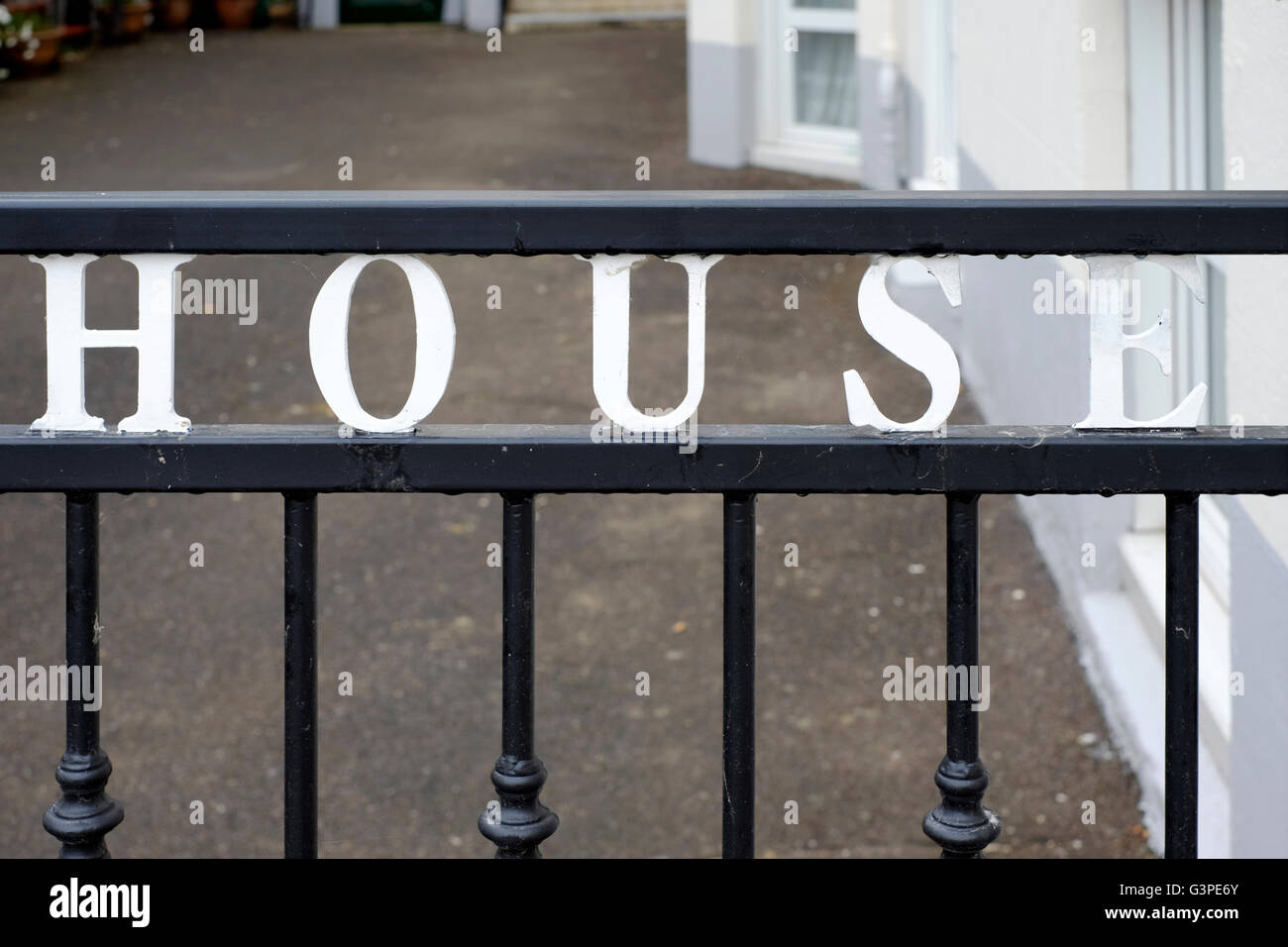 the word house on top of a metal garden gate driveway entrance uk Stock ...