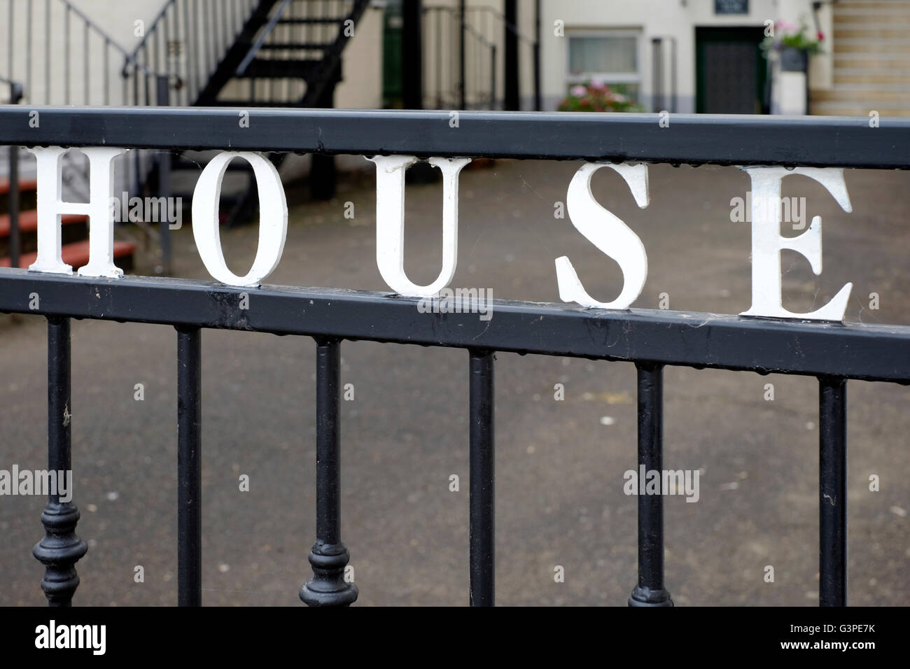 the word house on top of a metal garden gate driveway entrance uk Stock ...