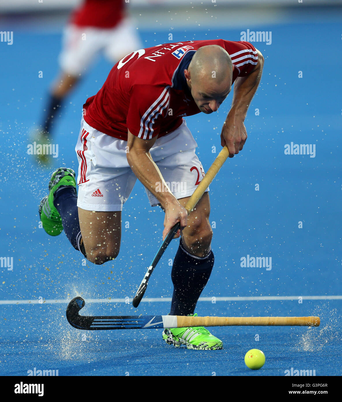 Great Britain's Nick Catlin is tripped up by a stray stick during day ...