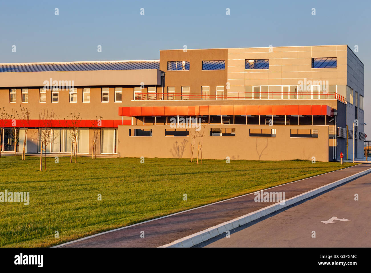 Details of gray and red facade on modern residential building made of ...