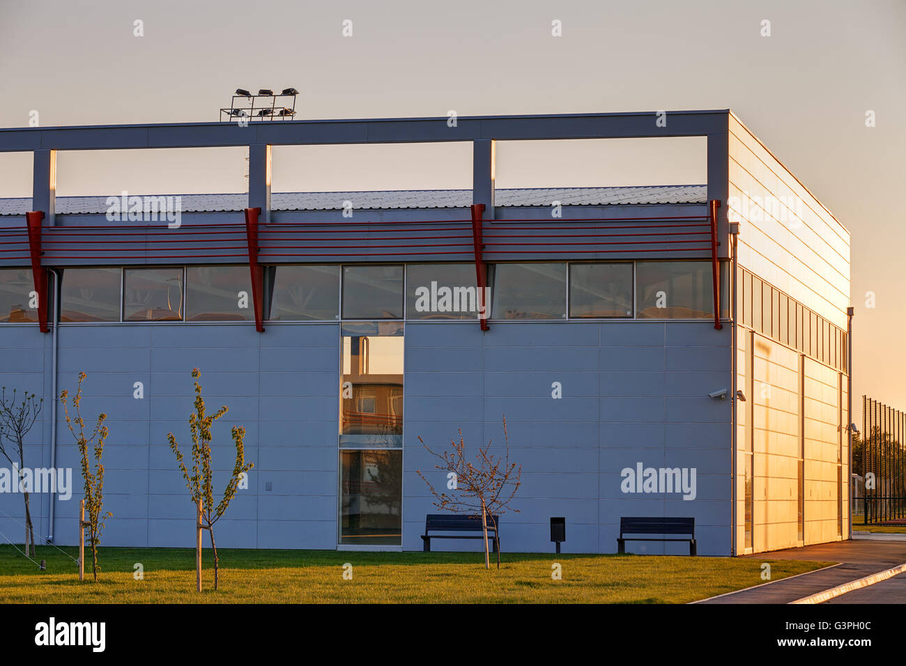 Details of gray and red facade on modern residential building made of ...