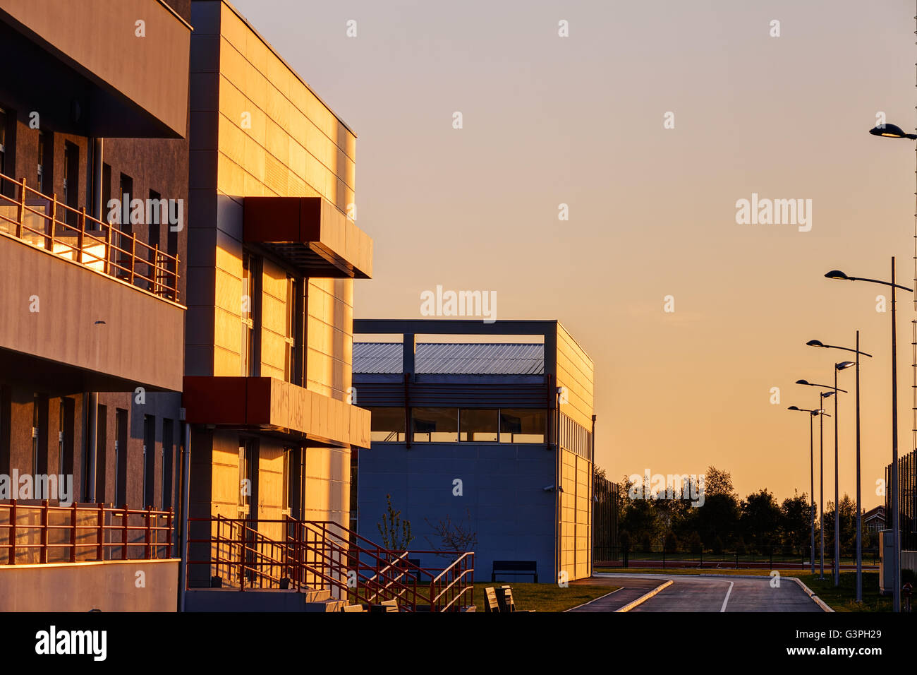 Details of gray and red facade on modern residential building made of ...