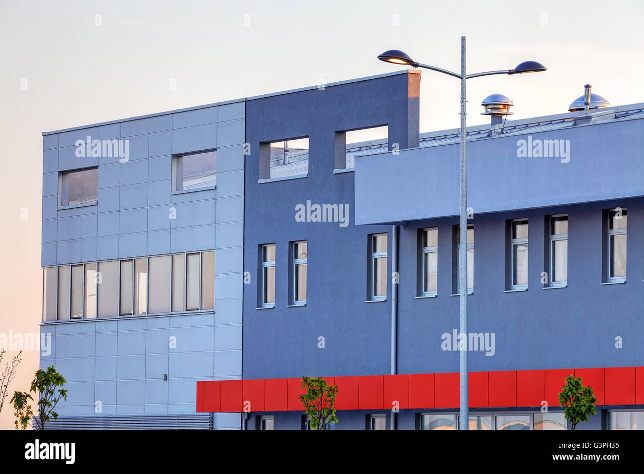 Details of gray and red facade on modern residential building made of ...