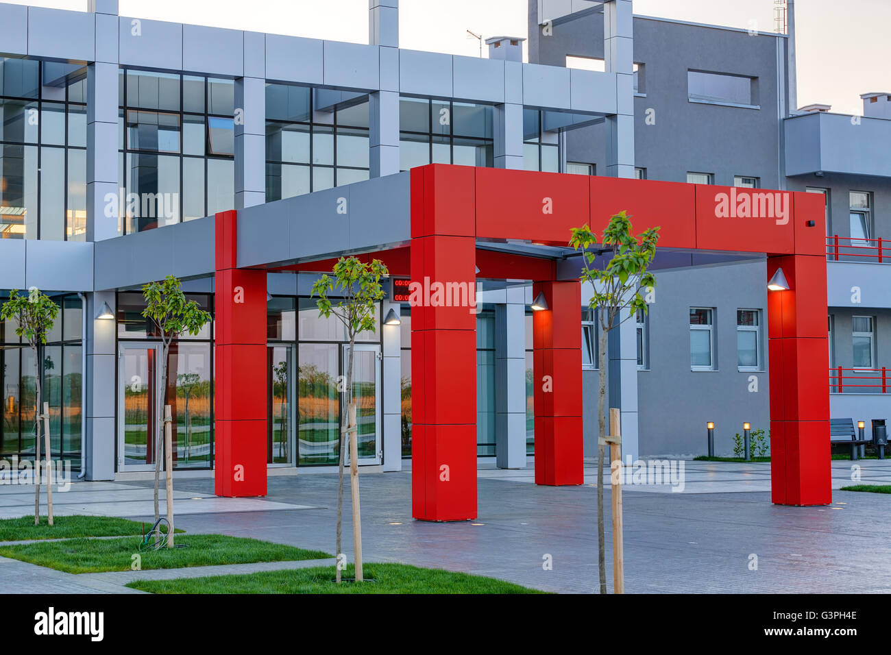 Details of gray and red facade on modern residential building made of ...