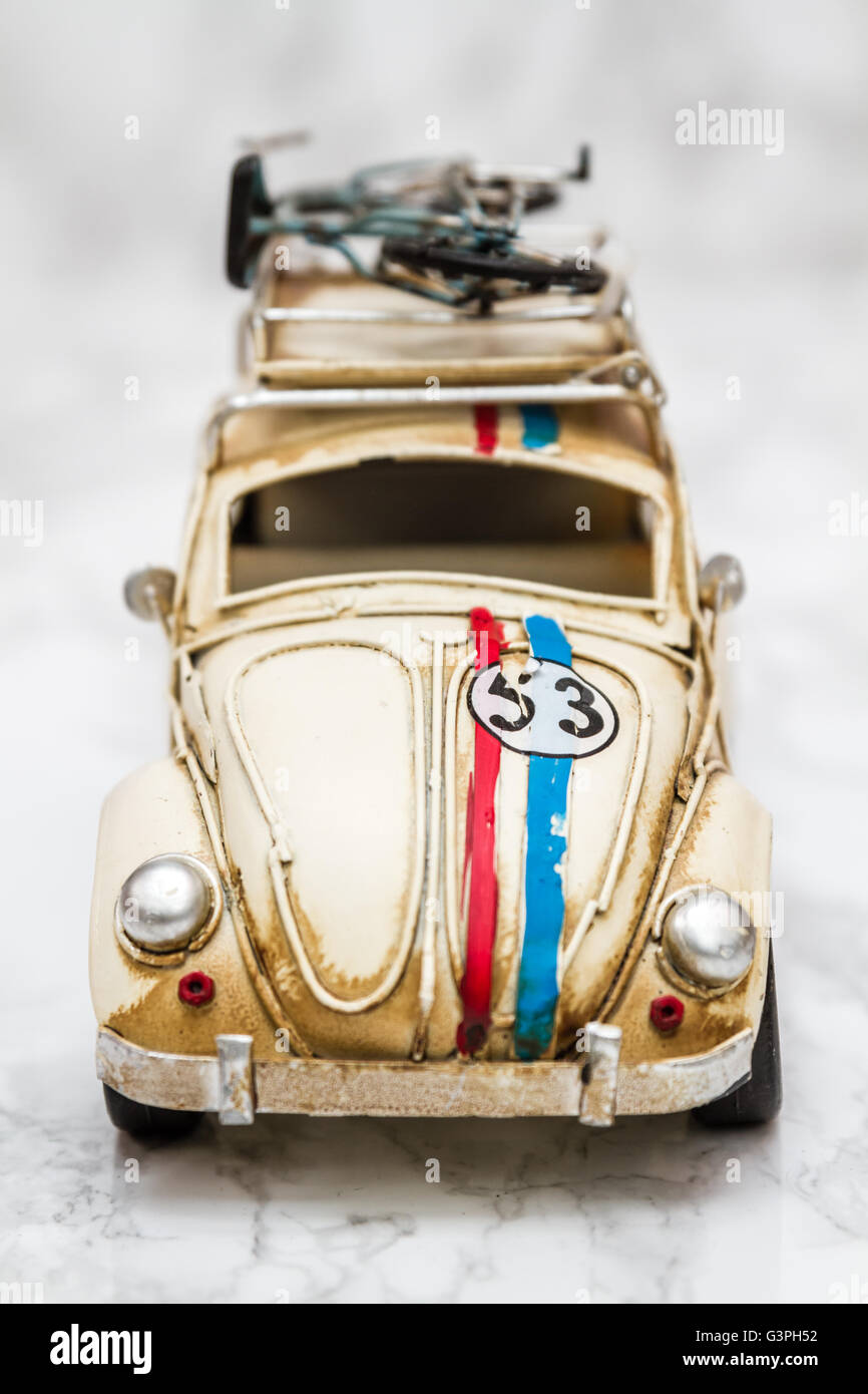 Classic mini cream car model on white marble background Stock Photo - Alamy