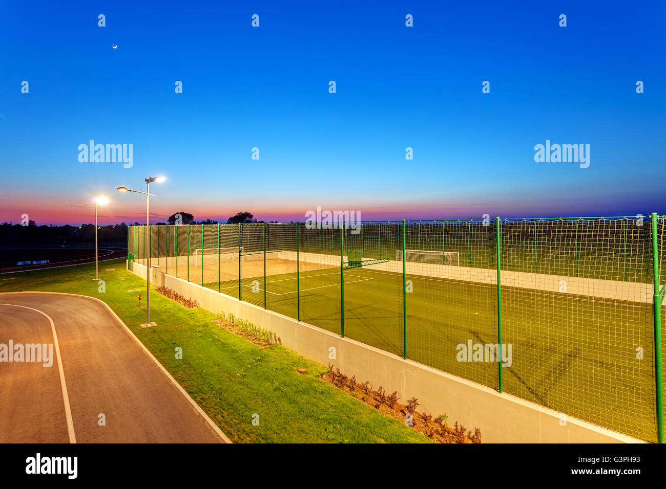 Small football pitch in sports center at night Stock Photo - Alamy
