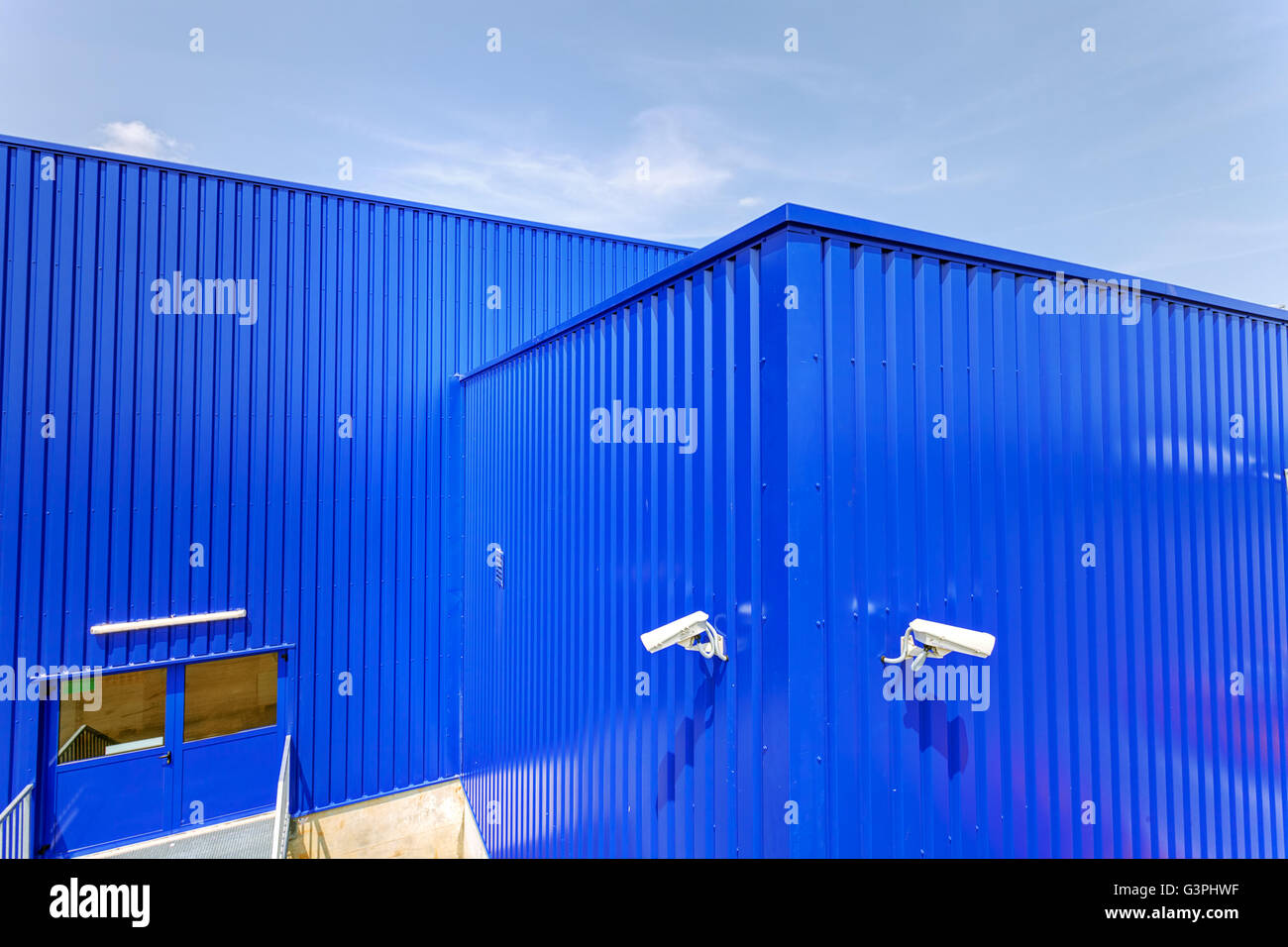 Details of blue facade with and aluminum panels on industrial building ...