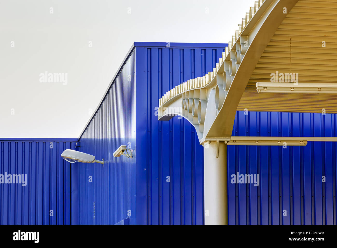 Details of blue facade with and aluminum panels on industrial building ...