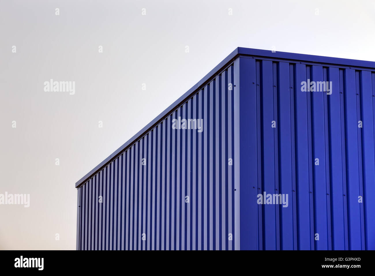 Details of blue facade with and aluminum panels on industrial building ...