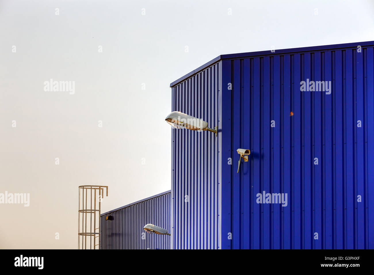 Details of blue facade with and aluminum panels on industrial building ...