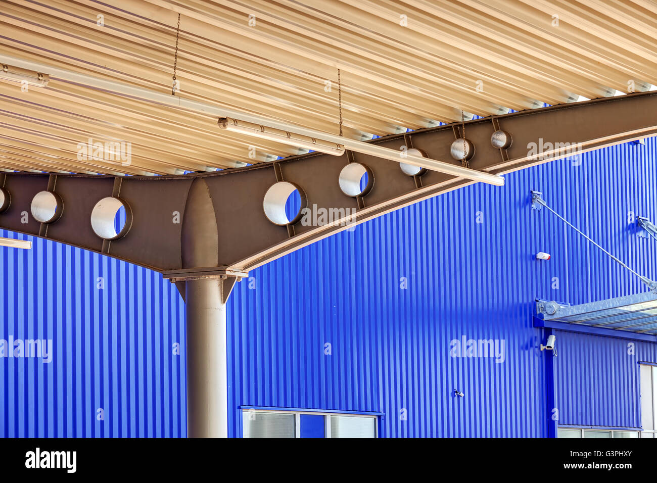 Details of blue facade with and aluminum panels on industrial building ...