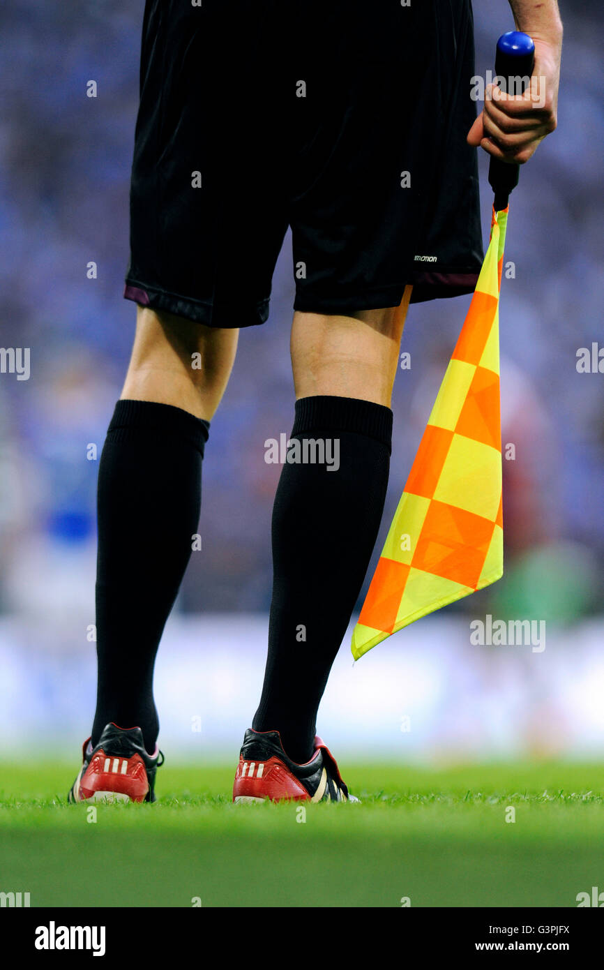 The assistant referee flags during the game hi-res stock photography ...