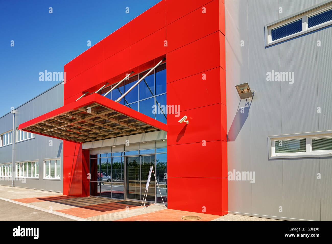 Facade on large industrial building made of aluminum panels Stock Photo ...