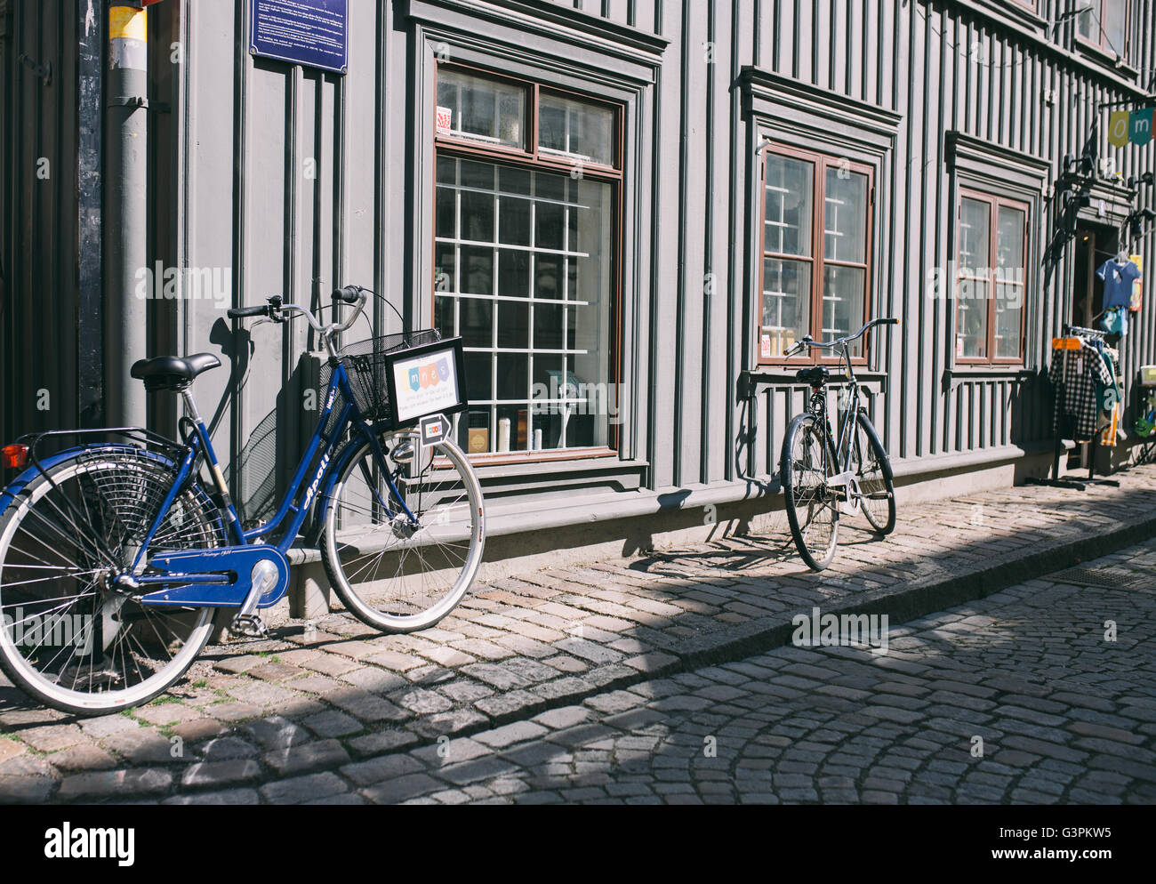 Bicycles leaning against the building wall Stock Photo - Alamy