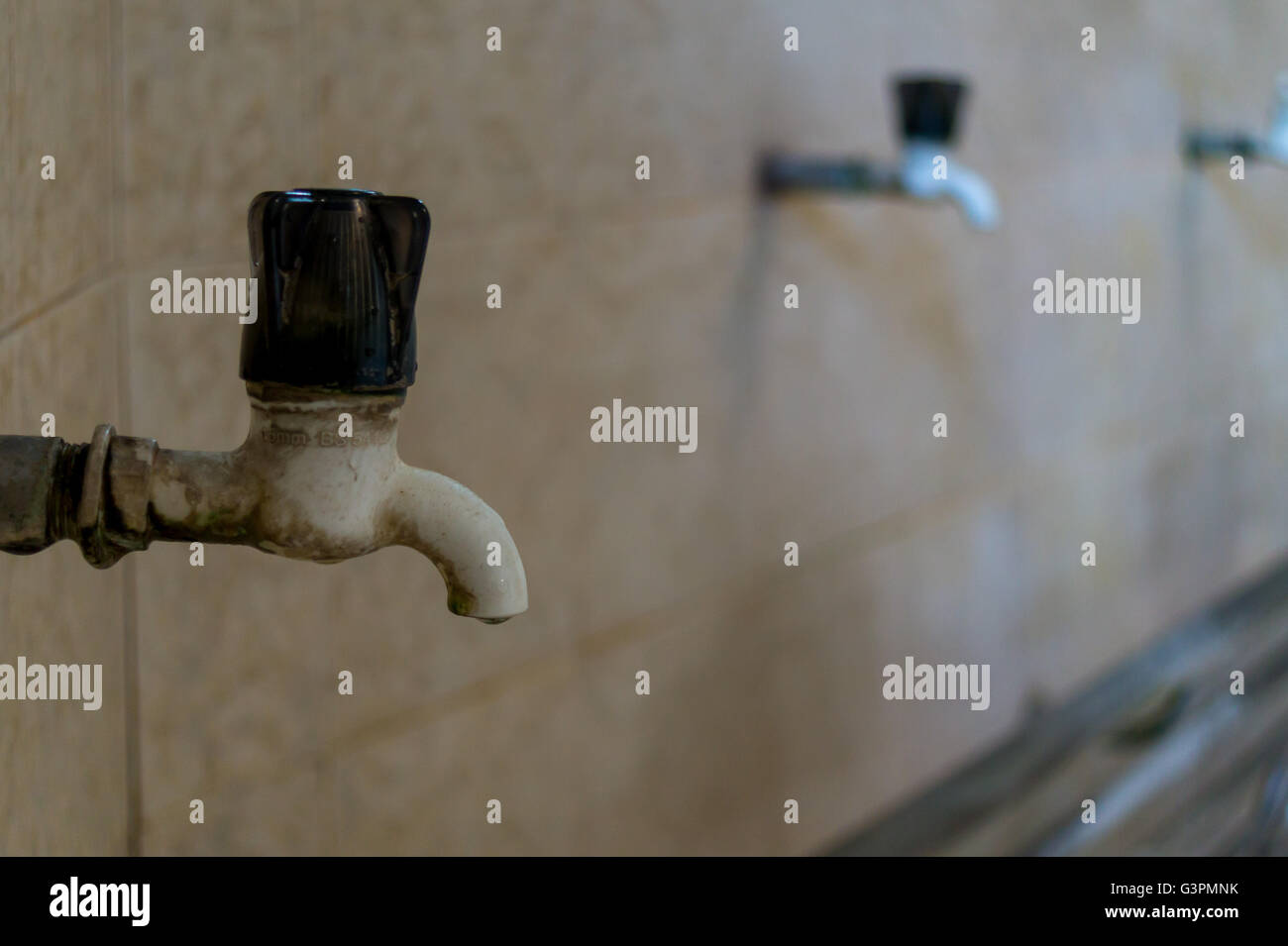 Plastic Mosque Water Tap on Ceramic Wall Stock Photo - Alamy