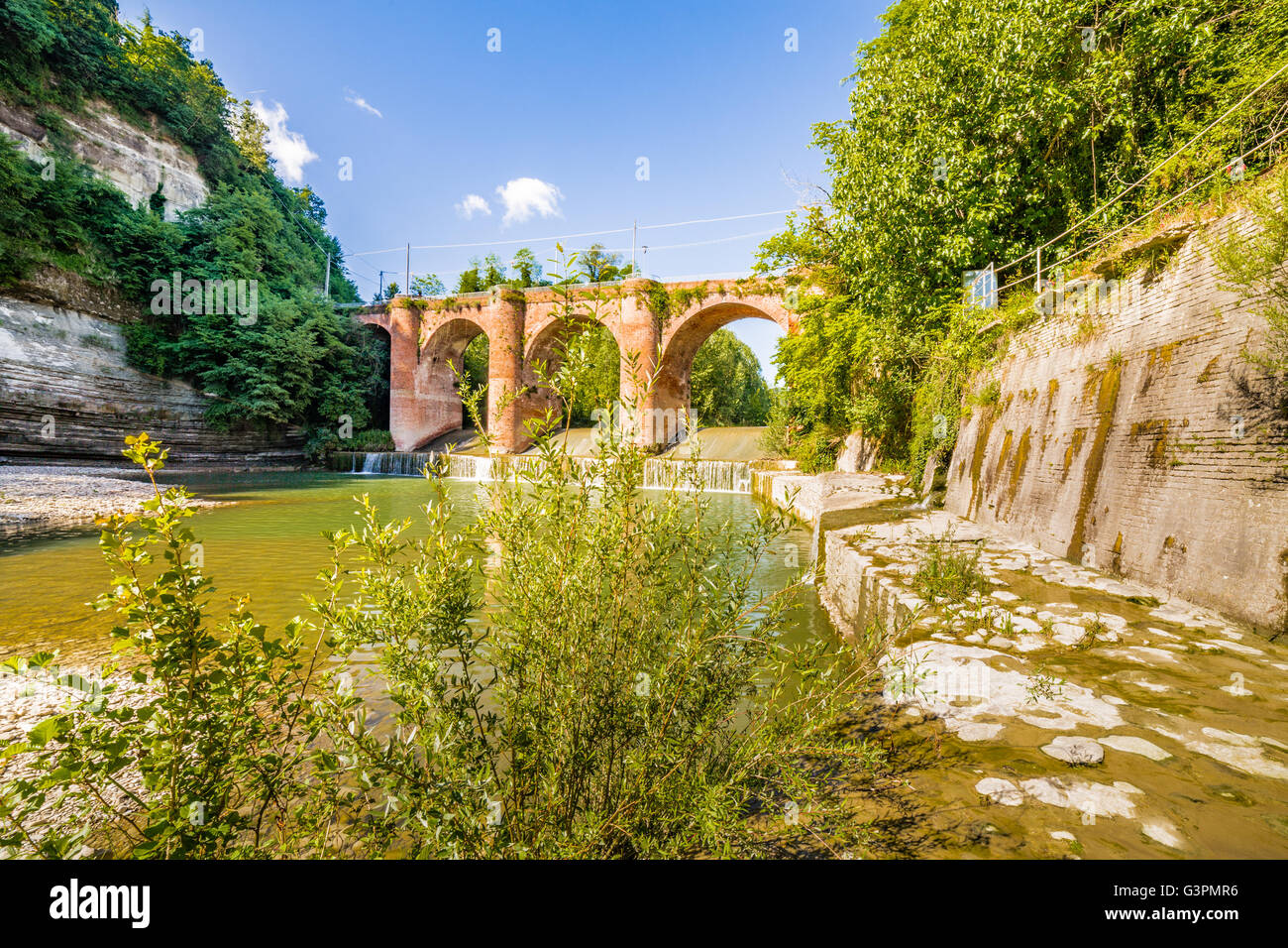 fourteenth century bridge in masonry over the River in a small village ...