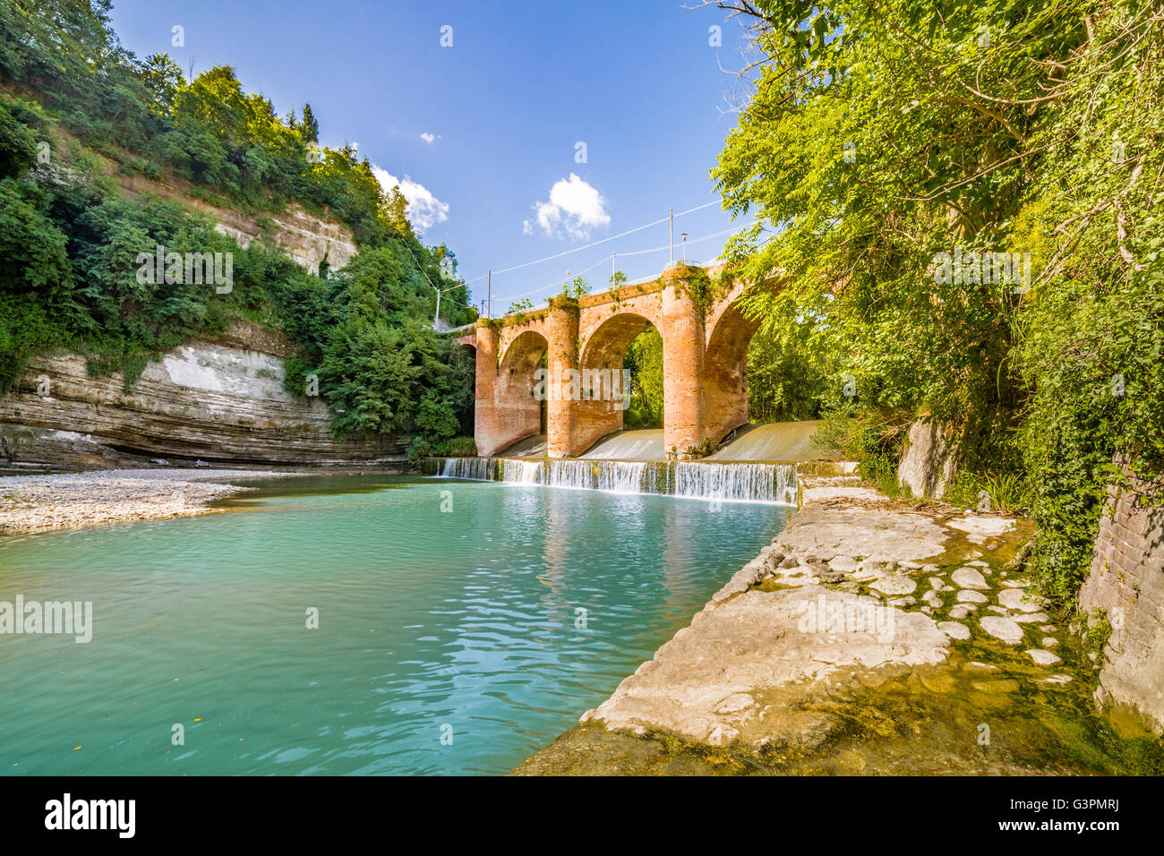 fourteenth century bridge in masonry over the River in a small village ...
