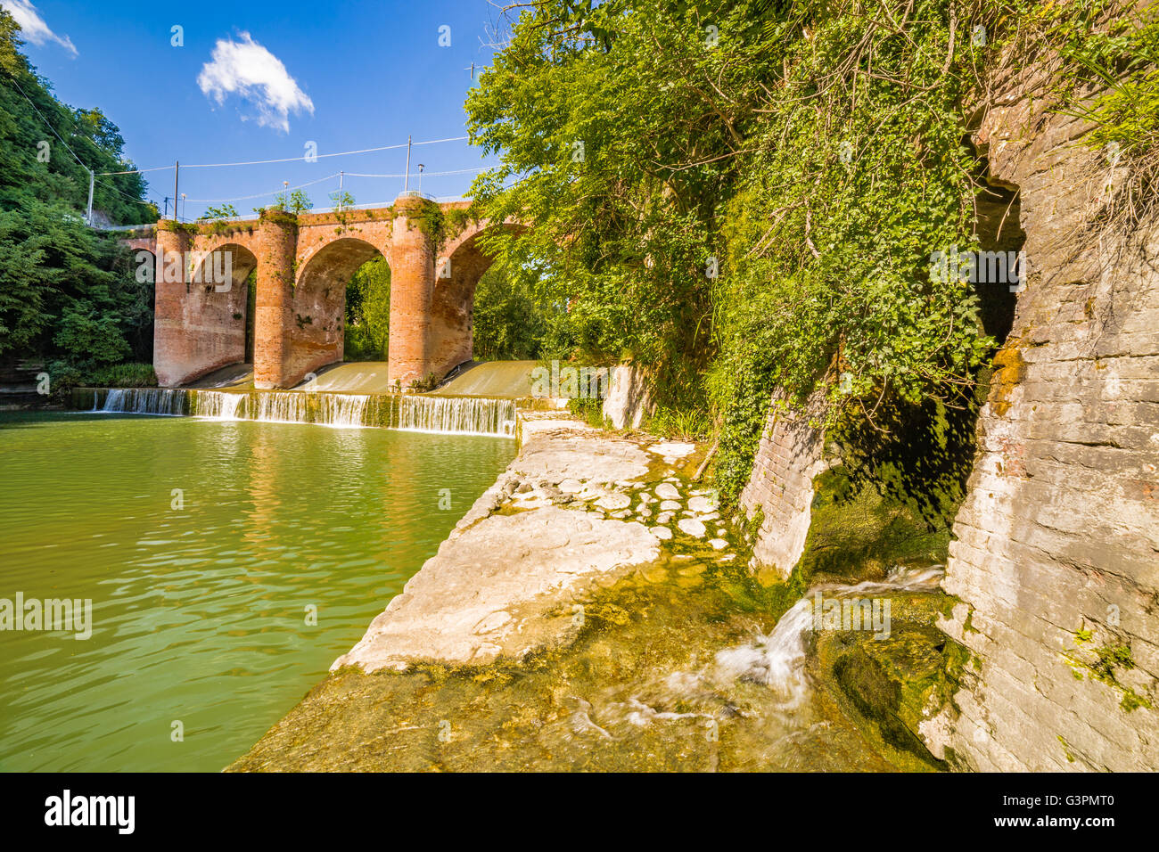 fourteenth century bridge in masonry over the River in a small village ...